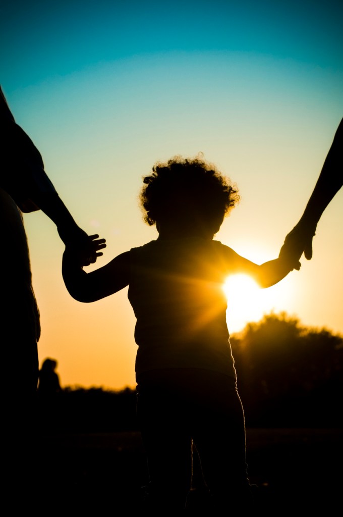 Silhouette of Child Holding Hands | ISDA Financial Life